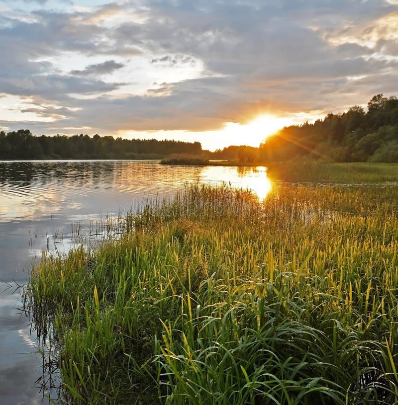 Reflection on still lake stock image. Image of sunlight - 25271461