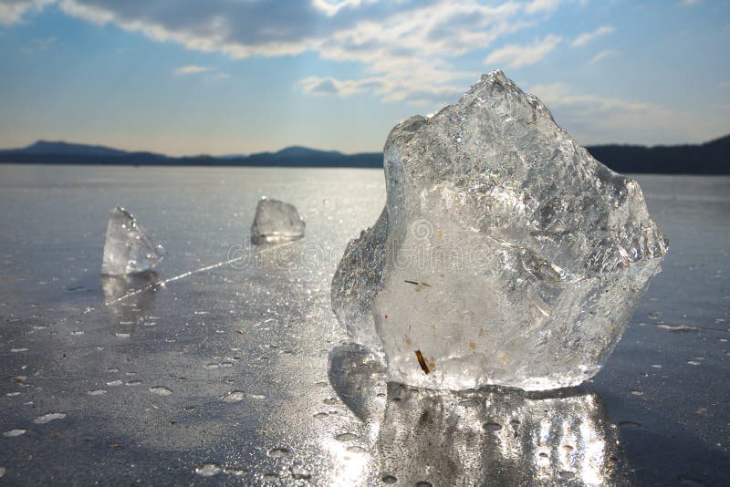 Reflection of Sun Rays in Flat Ice on the Lake. Air Bubbles Stock Photo ...