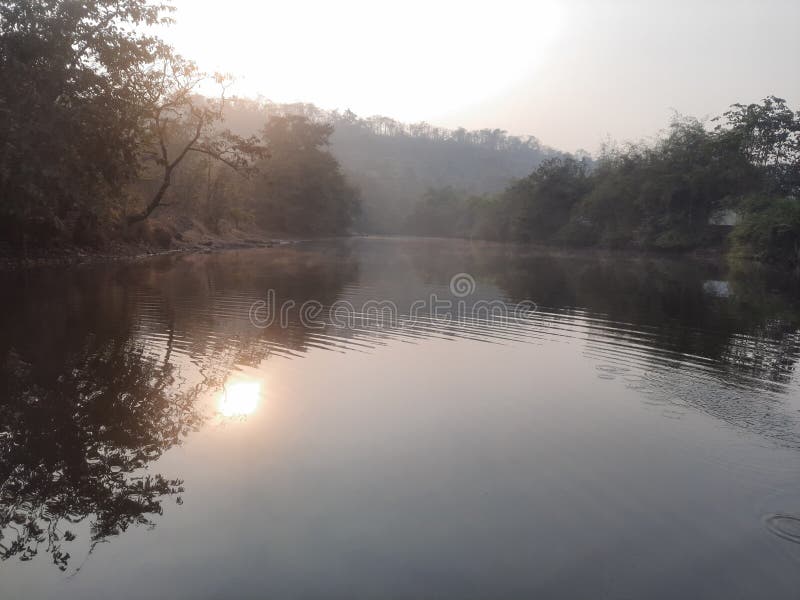 Reflection of sun in river stock image. Image of haze - 258472767