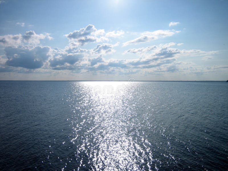 Reflection of Sun in the Water on Blue Sky Background, Horizontal View ...