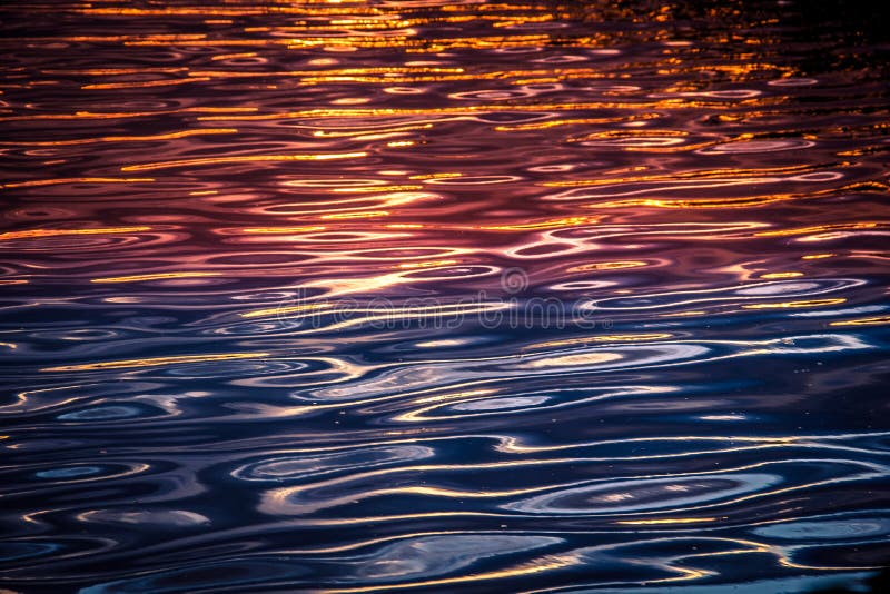 Reflection of sun in water stock photo. Image of golden - 140947314