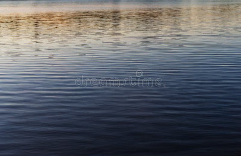 Reflection of Sunrise on the Surface of a Lake in Maine with a Slight ...
