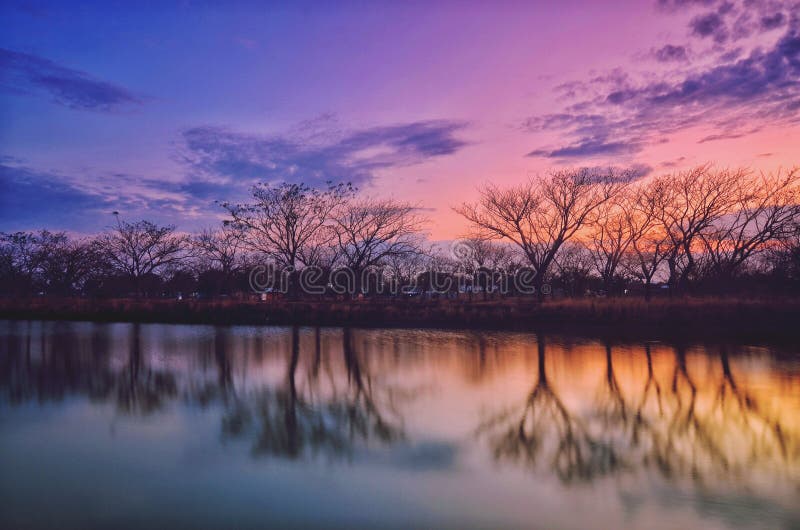 Reflection sunset stock photo. Image of landscape, sunset - 138761424