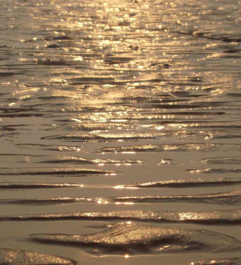 Reflection of a Sunset on Sandy Water S Edge Stock Photo - Image of ...