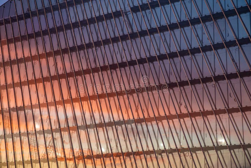 Reflection of the Sunset Sky in a Glass Facade of the Building ...