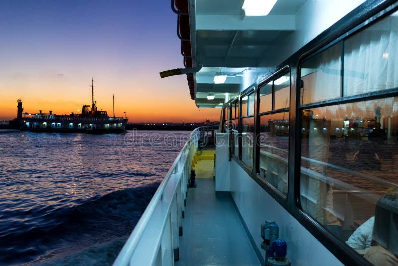 Reflection of a Sunset in the Windows of the Passenger Ferry Stock ...