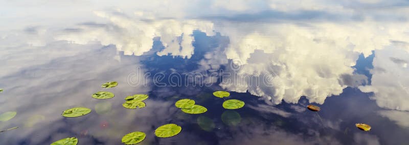 Reflection of Thunder Clouds in the Water. Stock Photo - Image of ...