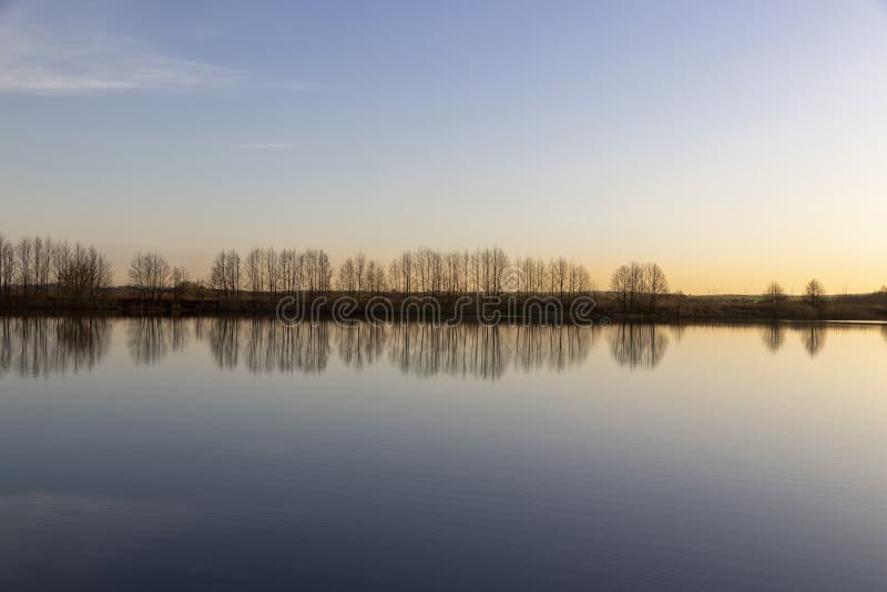 Reflection of Trees at Sunset, River with Reflection Stock Image ...