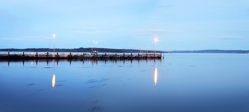 Reflection of Twilight on Lake with Pier Stock Photo - Image of water ...