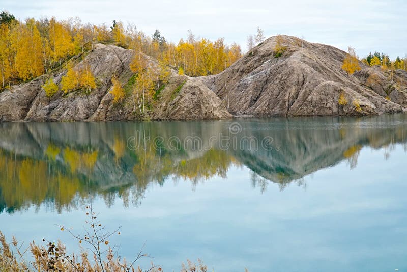 Reflection of Two Mountains in a Blue Lake. Autumn Stock Image - Image ...