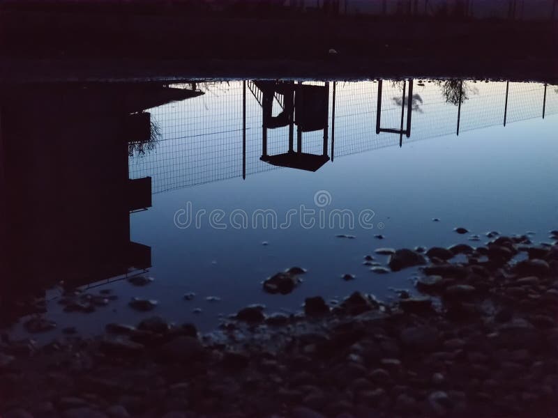 Reflection on the Water of a Beach Watchtower Stock Image - Image of ...