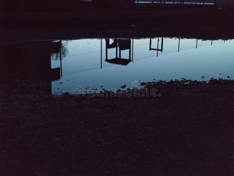 Reflection on the Water of a Beach Watchtower Stock Photo - Image of ...