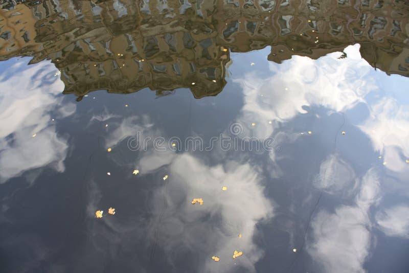 The Reflection in the Water. Clouds and Houses Stock Image - Image of ...