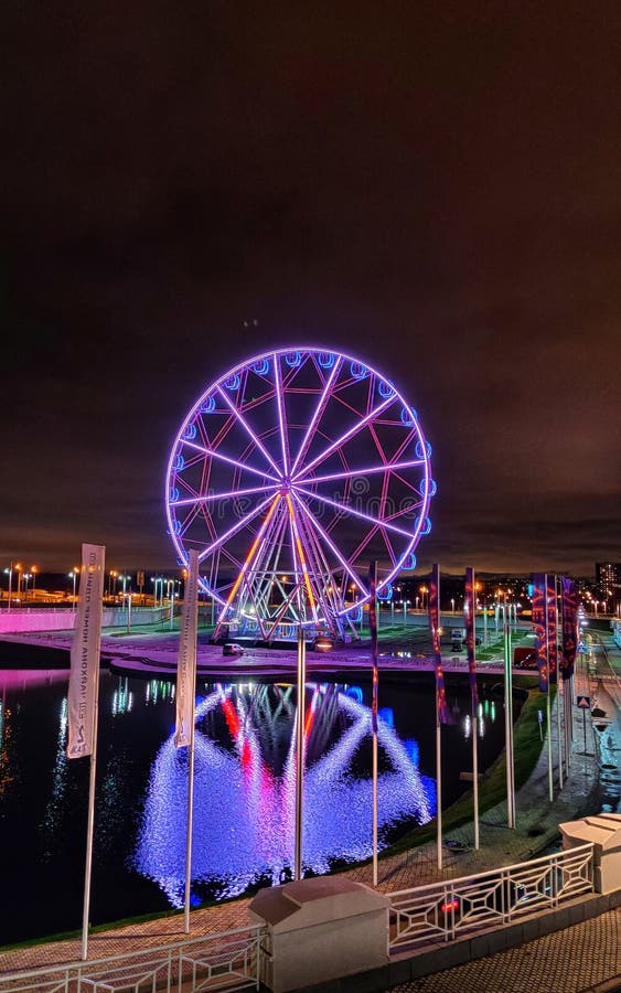 Reflection in Water of the Ferris Wheel at Night Stock Photo - Image of ...