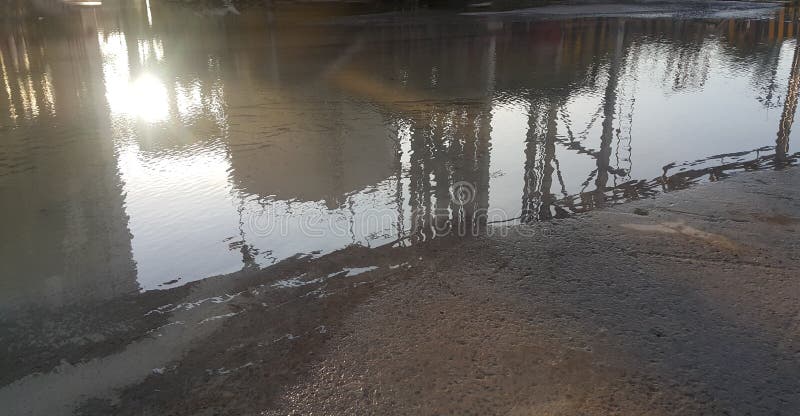 Reflection In Water On The Ground Stock Image - Image of black, rainy ...