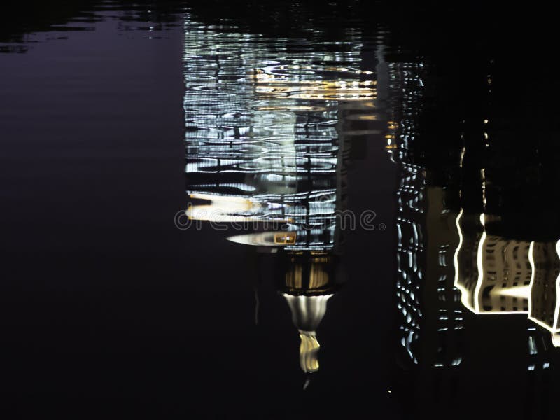 Reflection of Water in Office Building Lit at Night Stock Image - Image ...
