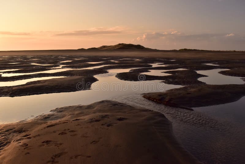 A Small Puddles in the Sand after Low Tide in Sunset Light Stock Photo ...