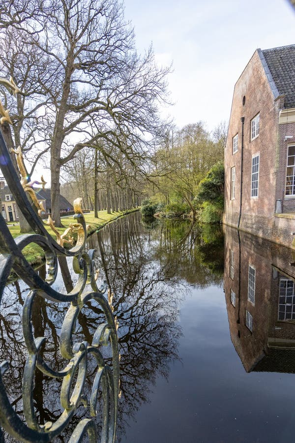 Reflection in Water Surface of Moat of Bare Trees at Groeneveld Castle ...