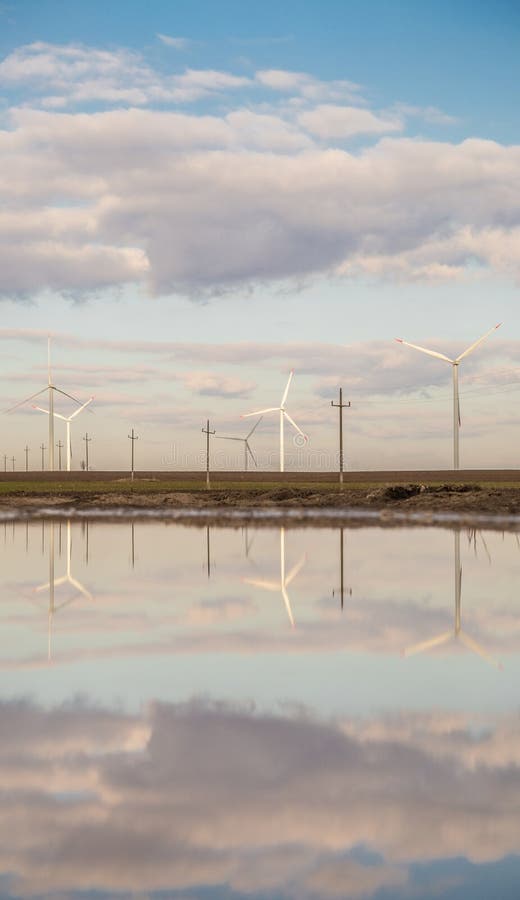 Reflection in Water of Wind Warm on Agricultural Ground with Cloudy Sky ...
