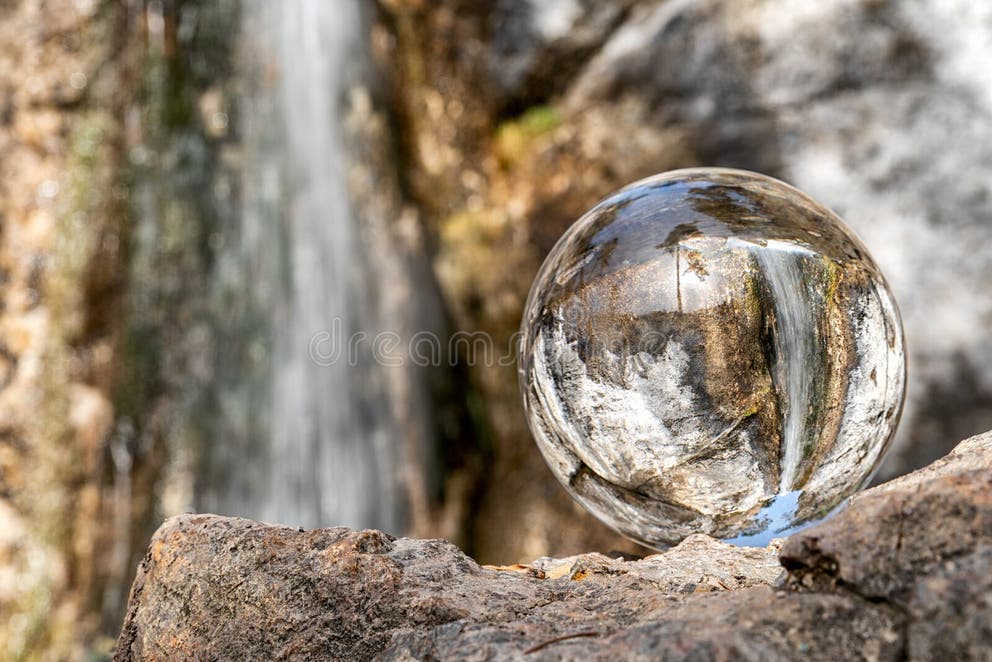 Reflection of Waterfall in Crystal Lens Ball Stock Photo - Image of ...