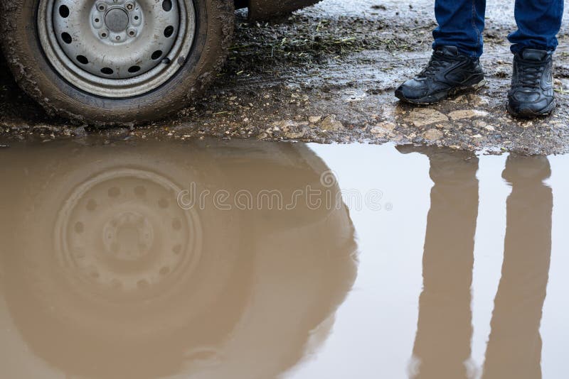 Reflection Wheel Car in a Muddy Puddle and Men S Shoes Stock Image ...