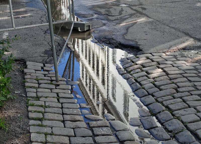 Puddle stock photo. Image of puddle, building, white - 109971800