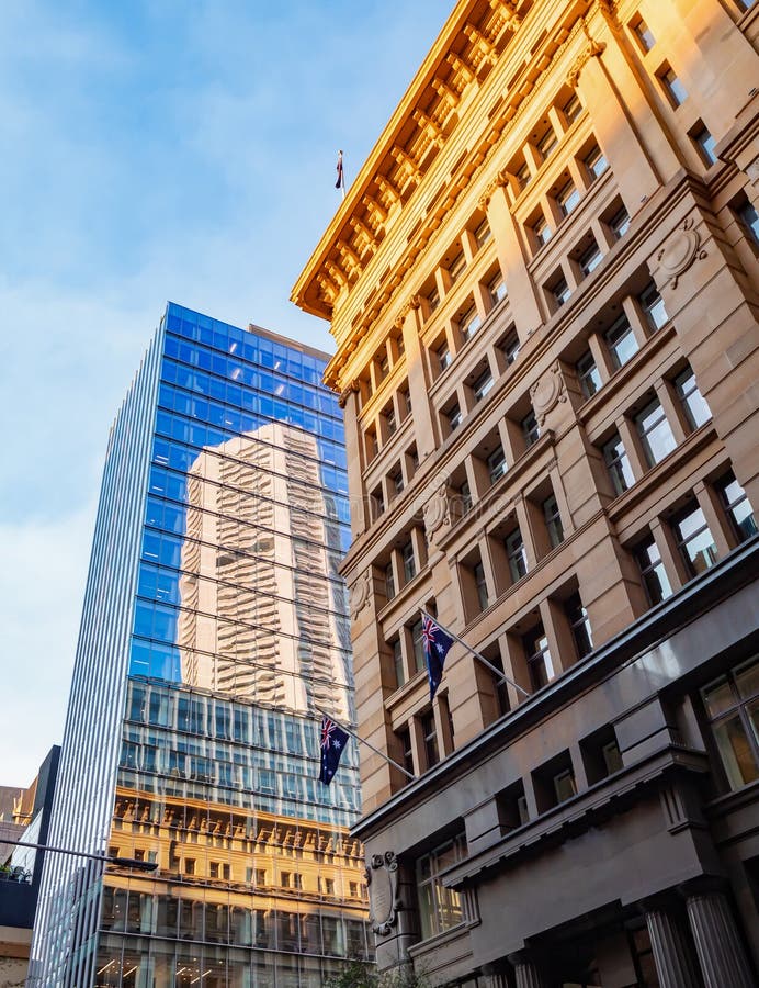 Reflection of a White Building in the Windows of a Business Building in ...