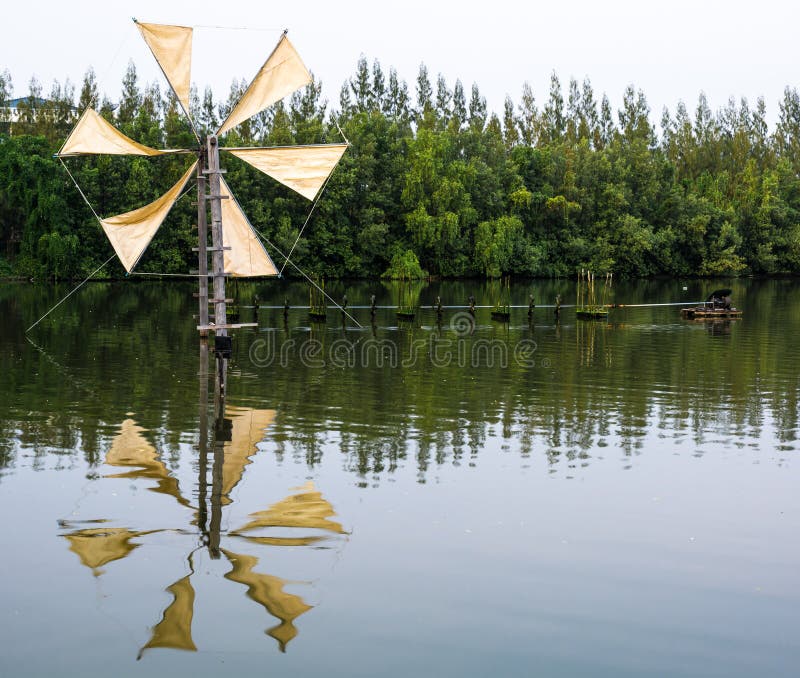 Reflection of Windmill for Pumping Water Stock Image - Image of lagoon ...