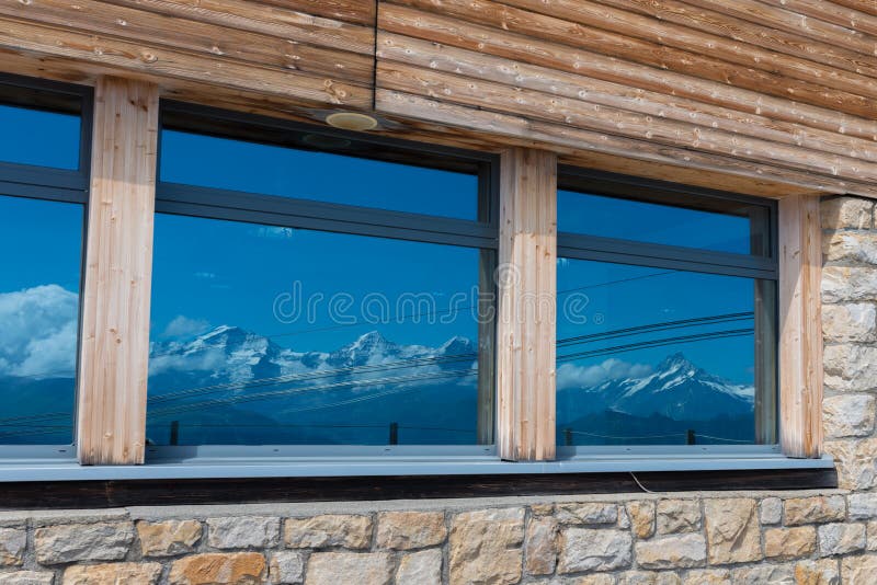 Reflection in the Window of the Swiss Alps Stock Image - Image of dawn ...