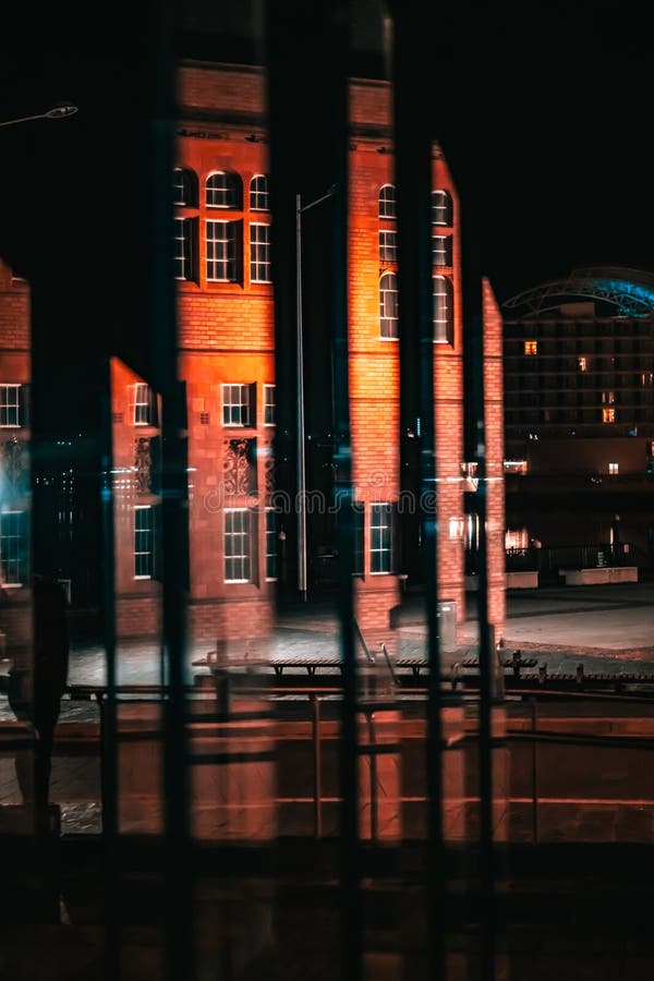 Reflection in the Windows of an Old Building in Cardiff Bay at Night ...