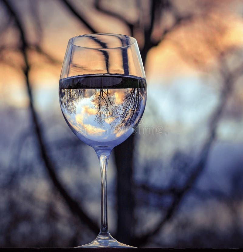 Reflection in a wine glass stock image. Image of sunset - 92831611