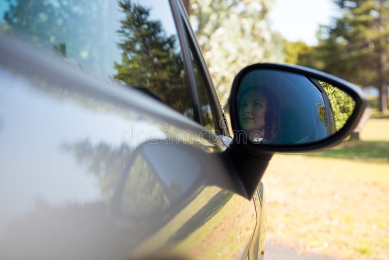 Reflection of Woman in Wing Mirror Driving a Car Stock Photo - Image of ...