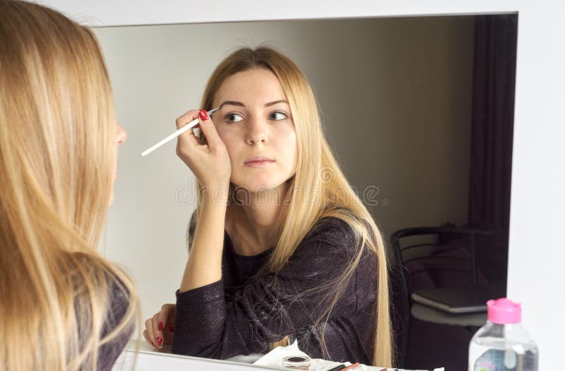 Reflection of Young Beautiful Woman Applying Her Make-up Stock Image ...