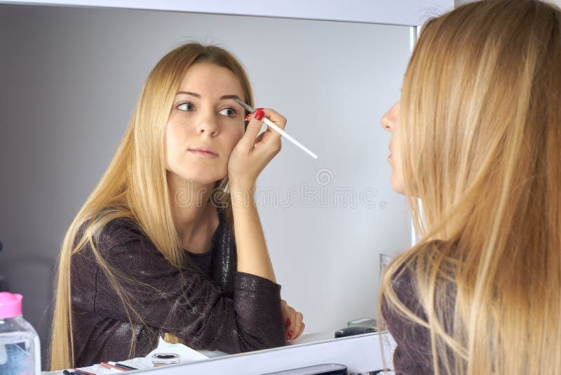 Reflection of Young Beautiful Woman Applying Her Make-up Stock Image ...