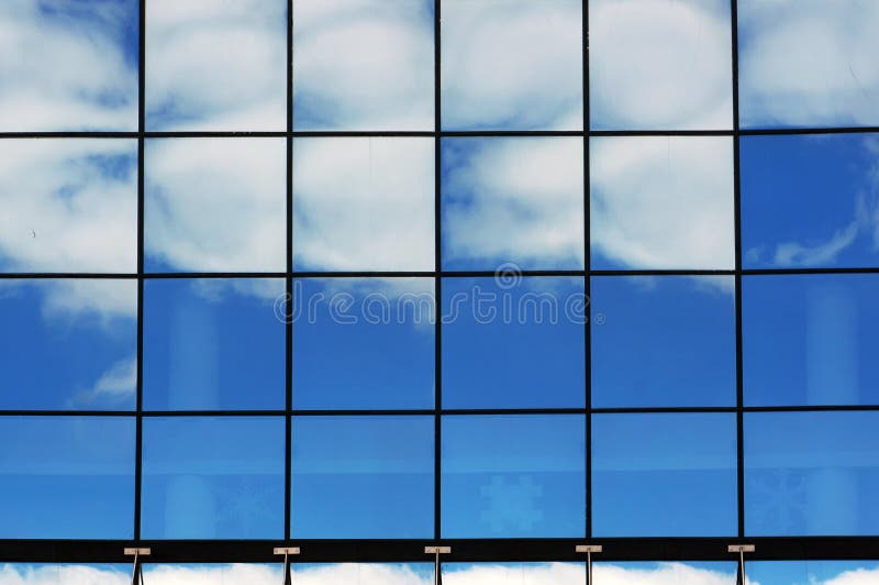 Reflections of Blue Sky and White Clouds in Windows Stock Image - Image ...