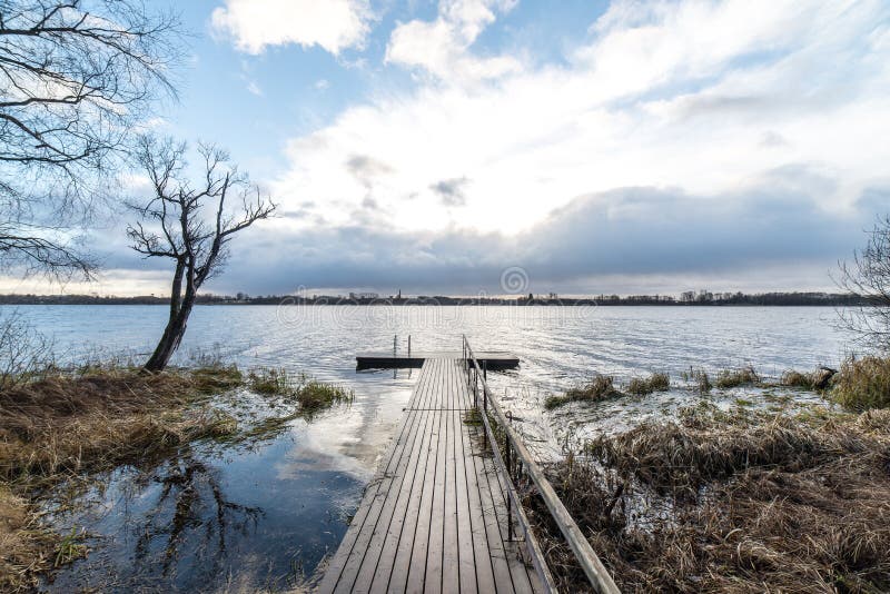 Reflections in the Calm Lake Water with Boardwalk Stock Image - Image ...