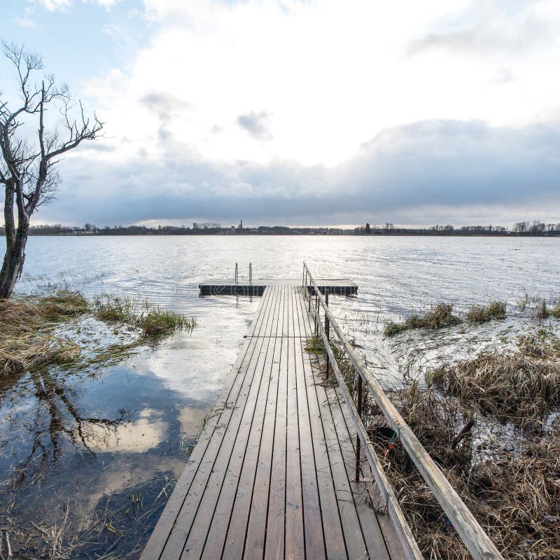 Reflections in the Calm Lake Water with Boardwalk Stock Photo - Image ...