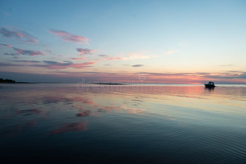Reflections in the Calm Lake Water with Small Boat Stock Photo - Image ...