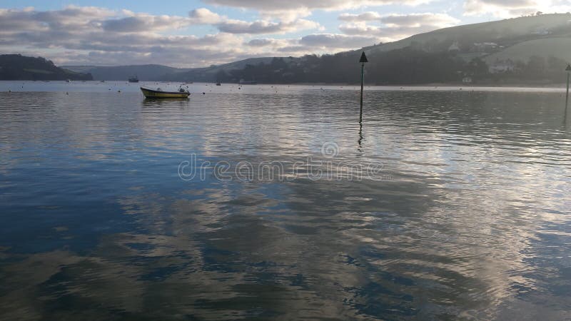 Reflections of the Clouds in a Harbour in Devon Stock Photo - Image of ...