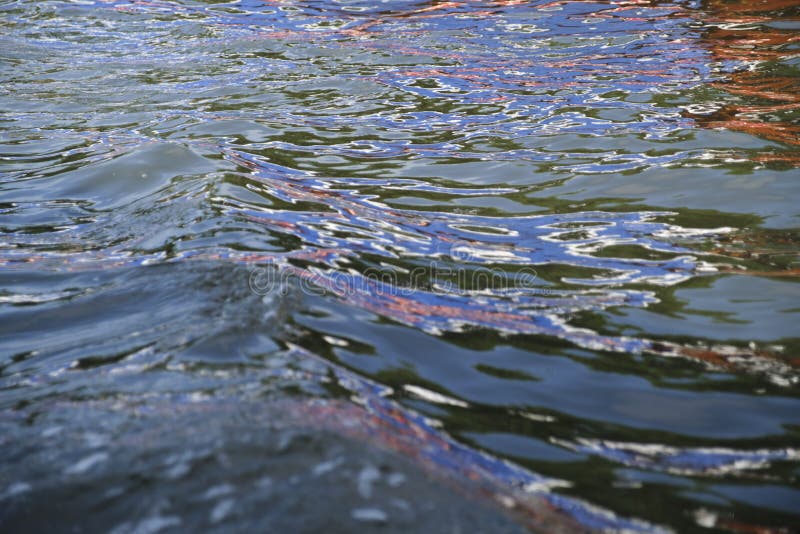 Colorful Reflections on the Water Surface of a River Creating an ...