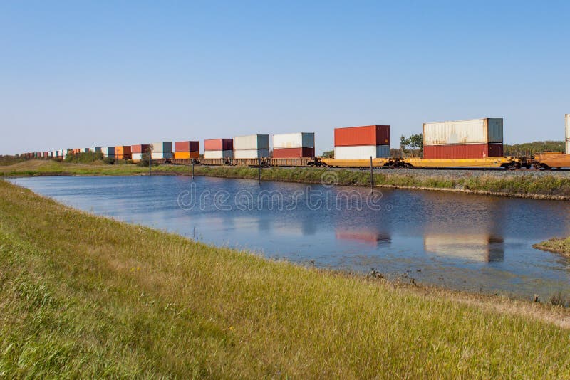 Reflections of Container Train in Pond Stock Photo - Image of industry ...