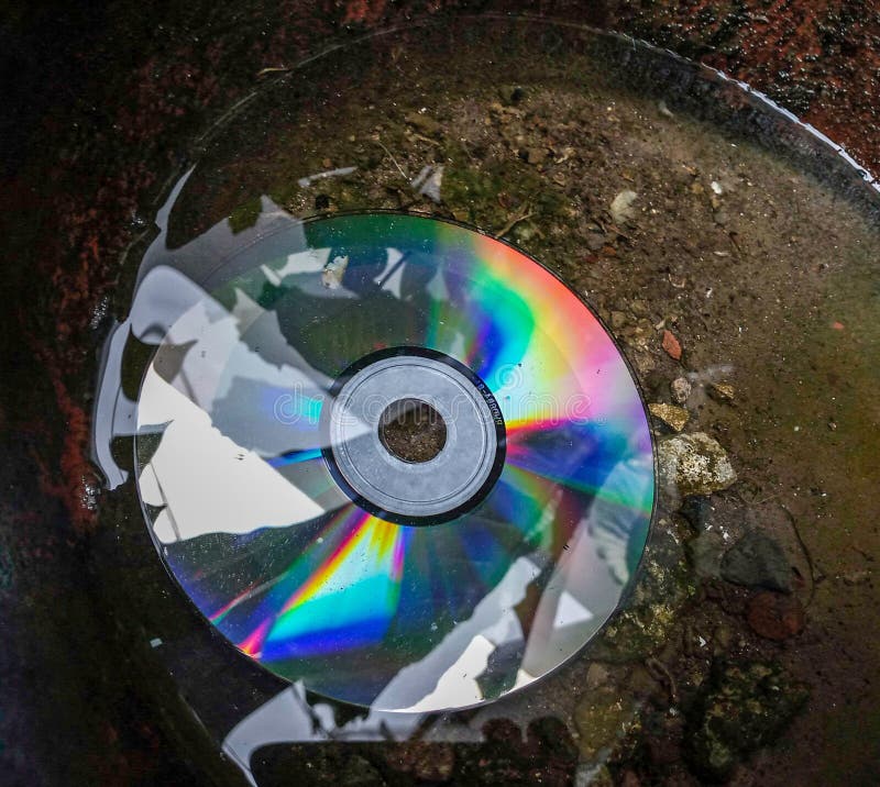 Reflections of a Disc in Water Rain Stock Photo - Image of partially ...