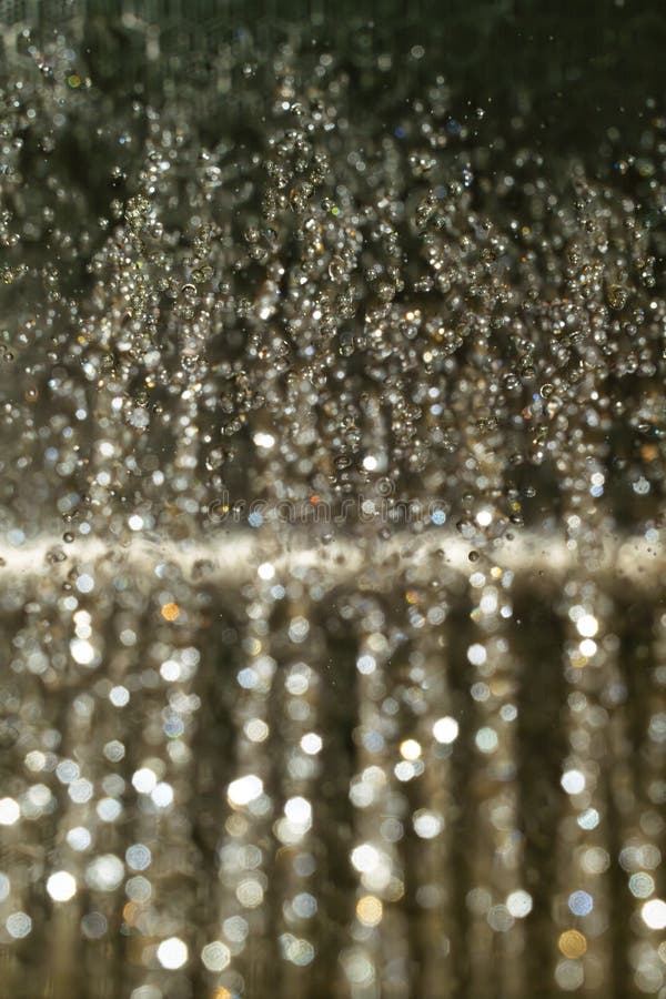 Reflections of Light in a Cascade of Sparkling Water Droplets Stock ...