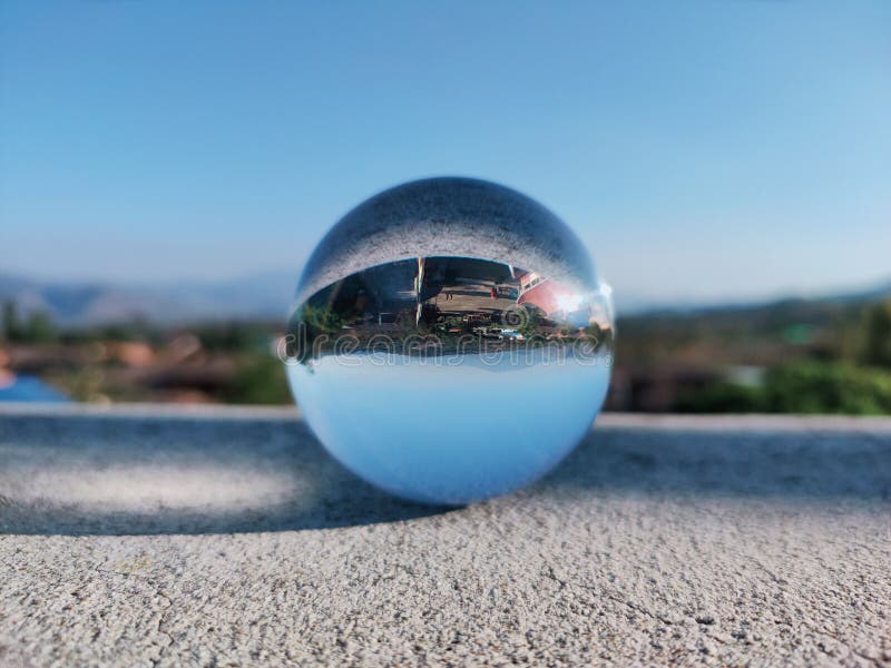 Reflections of Nature and the Outside Sky Look through the Glass Balls ...