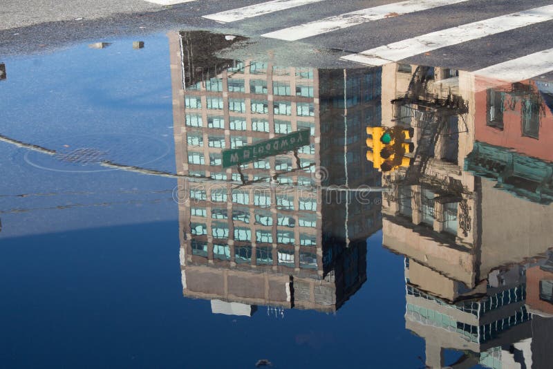 Reflections of New York City in a Puddle of Water Stock Photo - Image ...