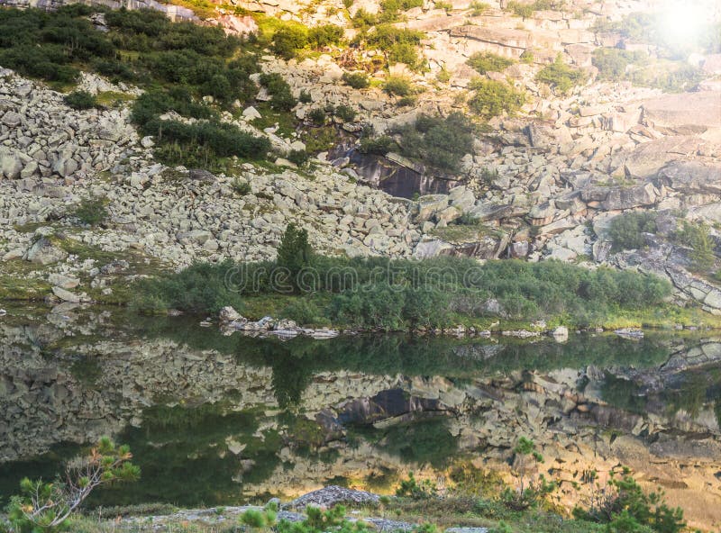 Reflections of Rocks and Mountains in the Lake Stock Photo - Image of ...