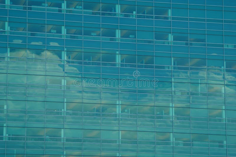 Reflections of Sky and Clouds on the Side of a Glass Building Stock ...