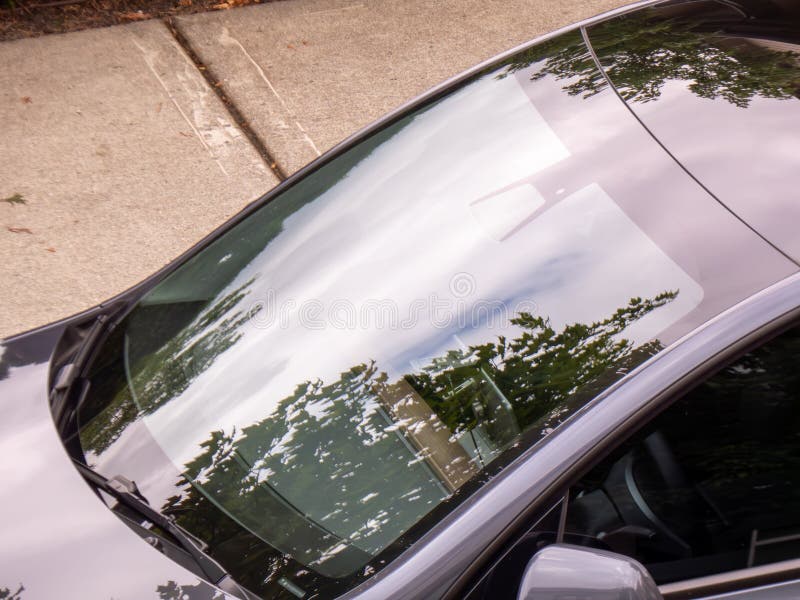 Reflections of the Sky and a Tree in the Windshield Stock Photo - Image ...