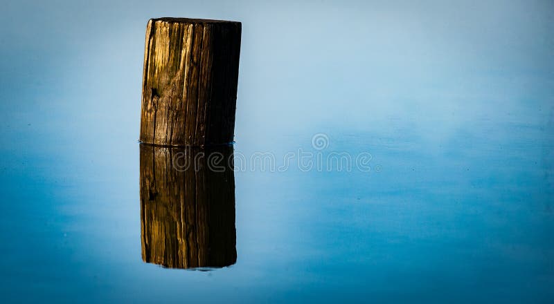 Reflections in still water stock image. Image of water - 65411295