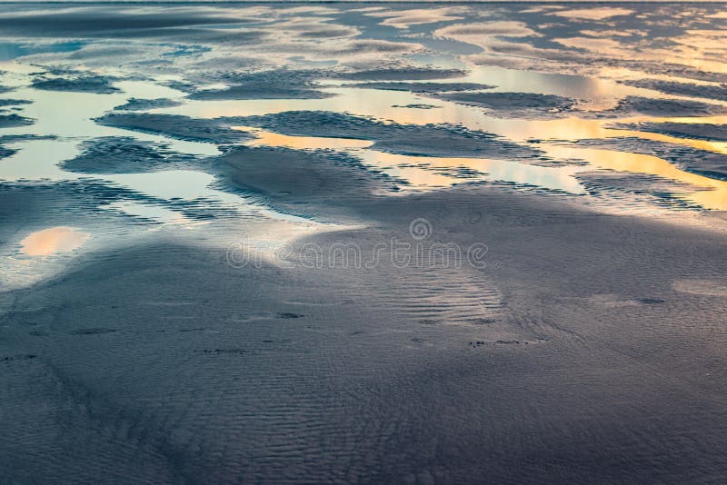 Reflections of the Sunset on the Beach Stock Image - Image of shore ...